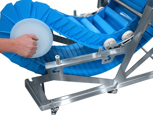 Move Products Vertically & Sanitary with the New AquaPruf Conveyor
